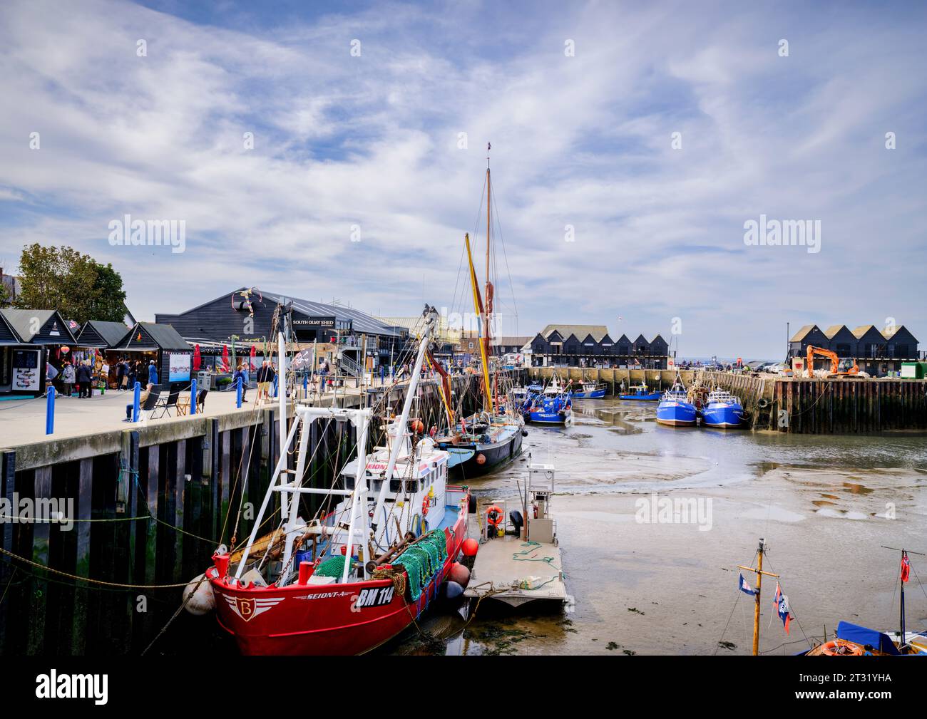 Editorial Use Only - Low tide in Whitstable harbour, fishing boats ...