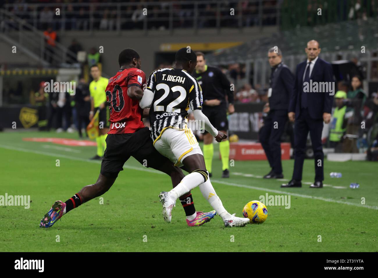 Milan, Italy. 22nd Oct, 2023. Yunus Musah of AC Milan shoulder barges Timothy Weah of Juventus ...