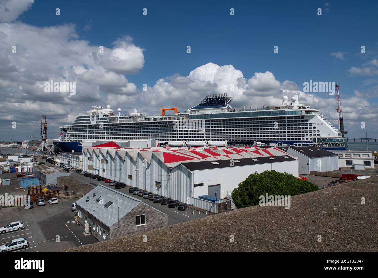 A cruise ship under construction or renovation at the Saint Nazaire ...