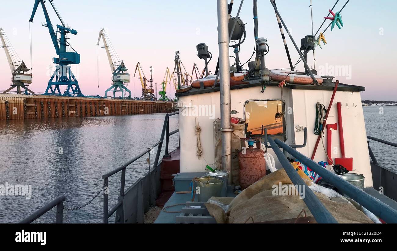 Boat sails at industrial seashore. Clip. Cargo boat sails to industrial ...