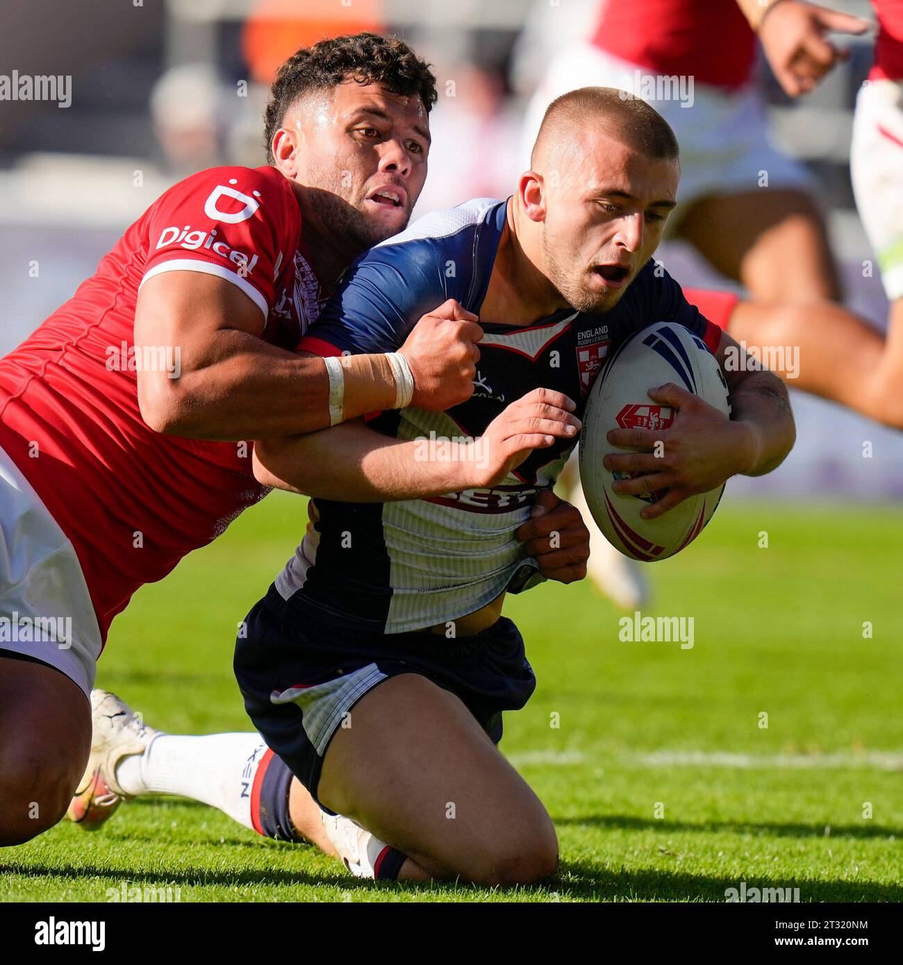 Starford To'a #2 of Tonga tackles Mikey Lewis #6 of England makes a ...