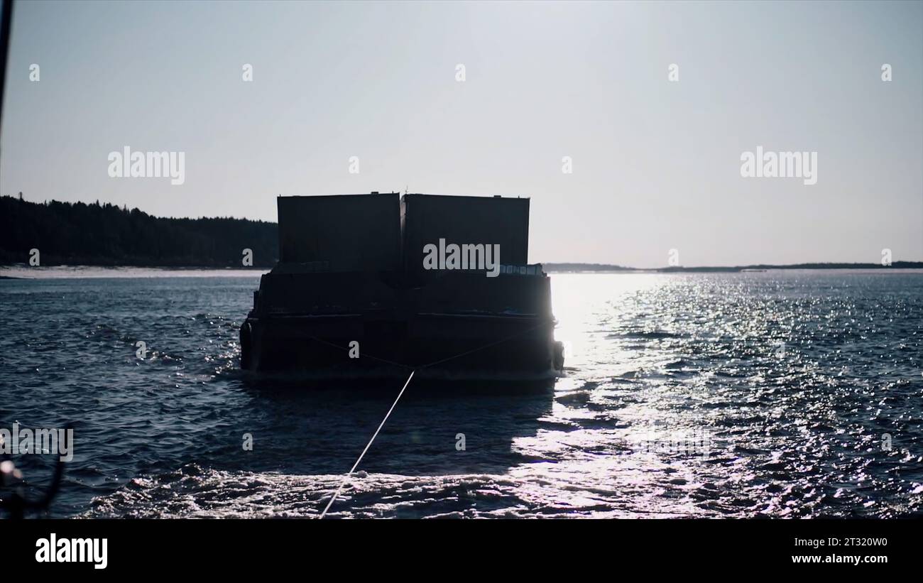 Water transport. Clip. A floating cargo ship with a deck filled with ...