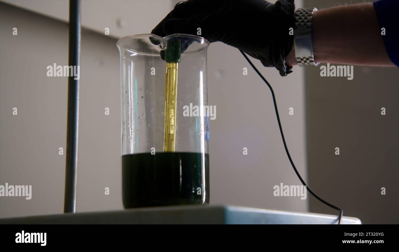 Chemical process. Stock footage. A small test tube with a green ...