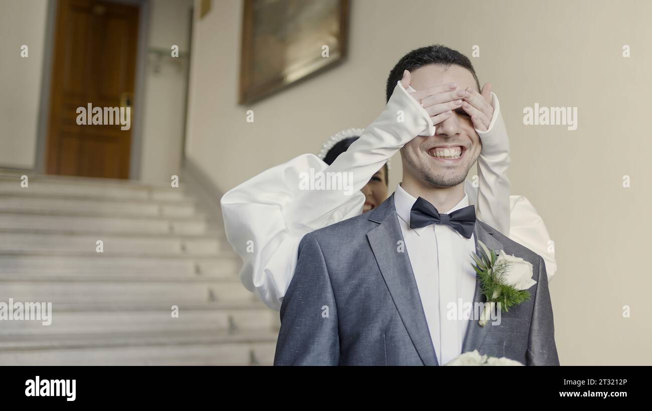 A couple of the bride and groom flirting with each other. Action ...