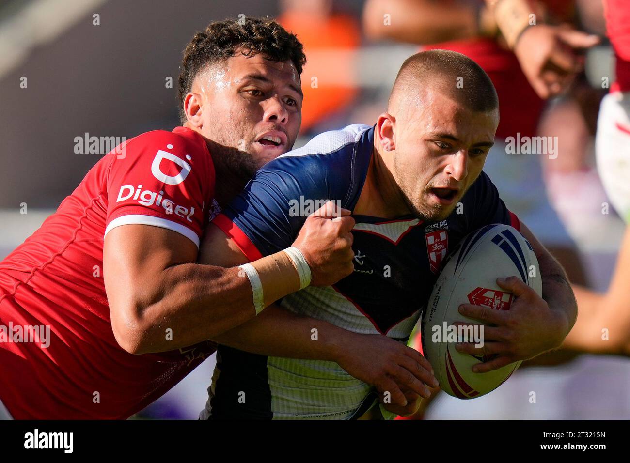 St Helens, UK. 22nd Oct, 2023. Starford To'a #2 of Tonga tackles Mikey ...