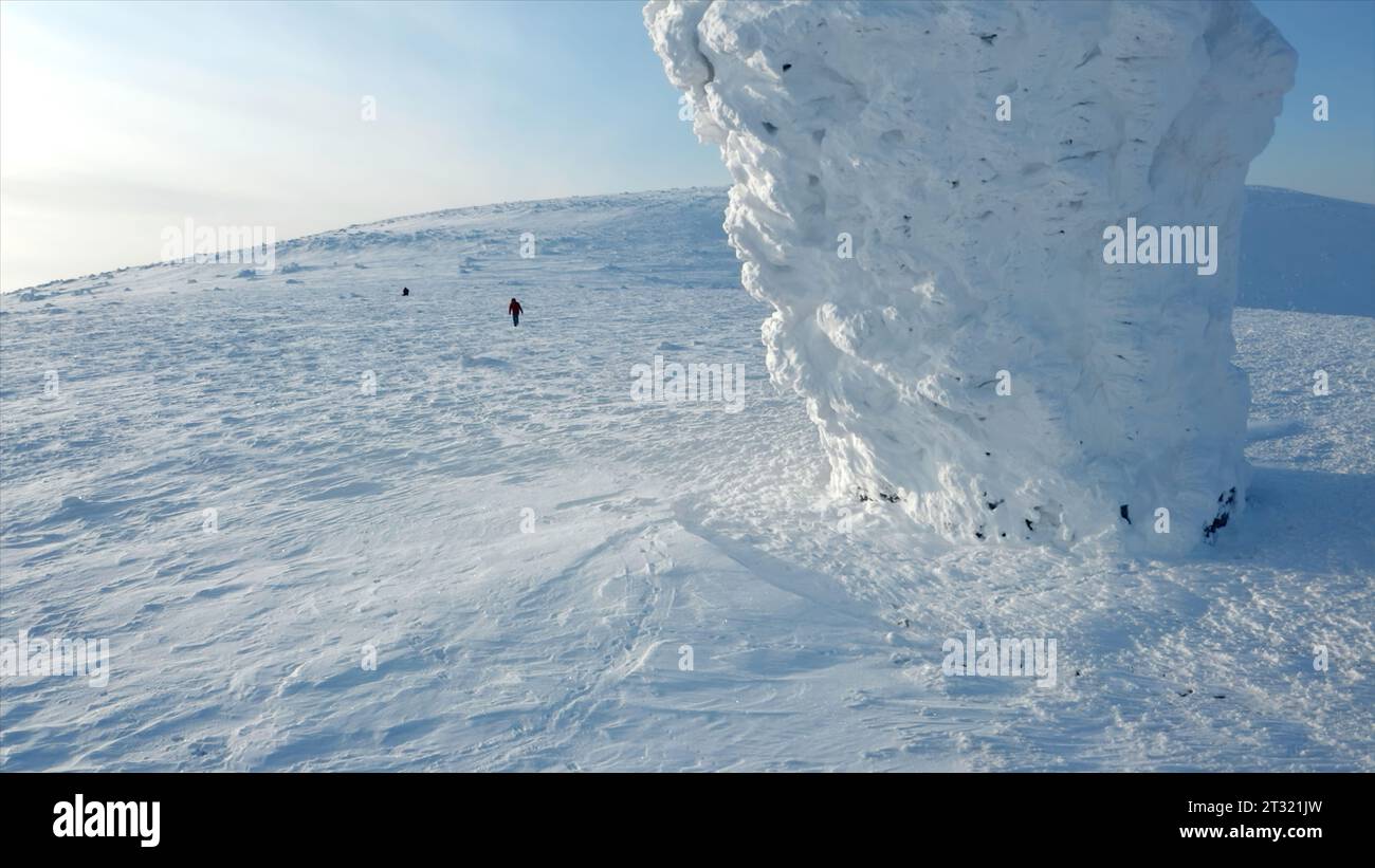 Frozen snowy mountains. Clip. Daytime landscape with huge hills that ...