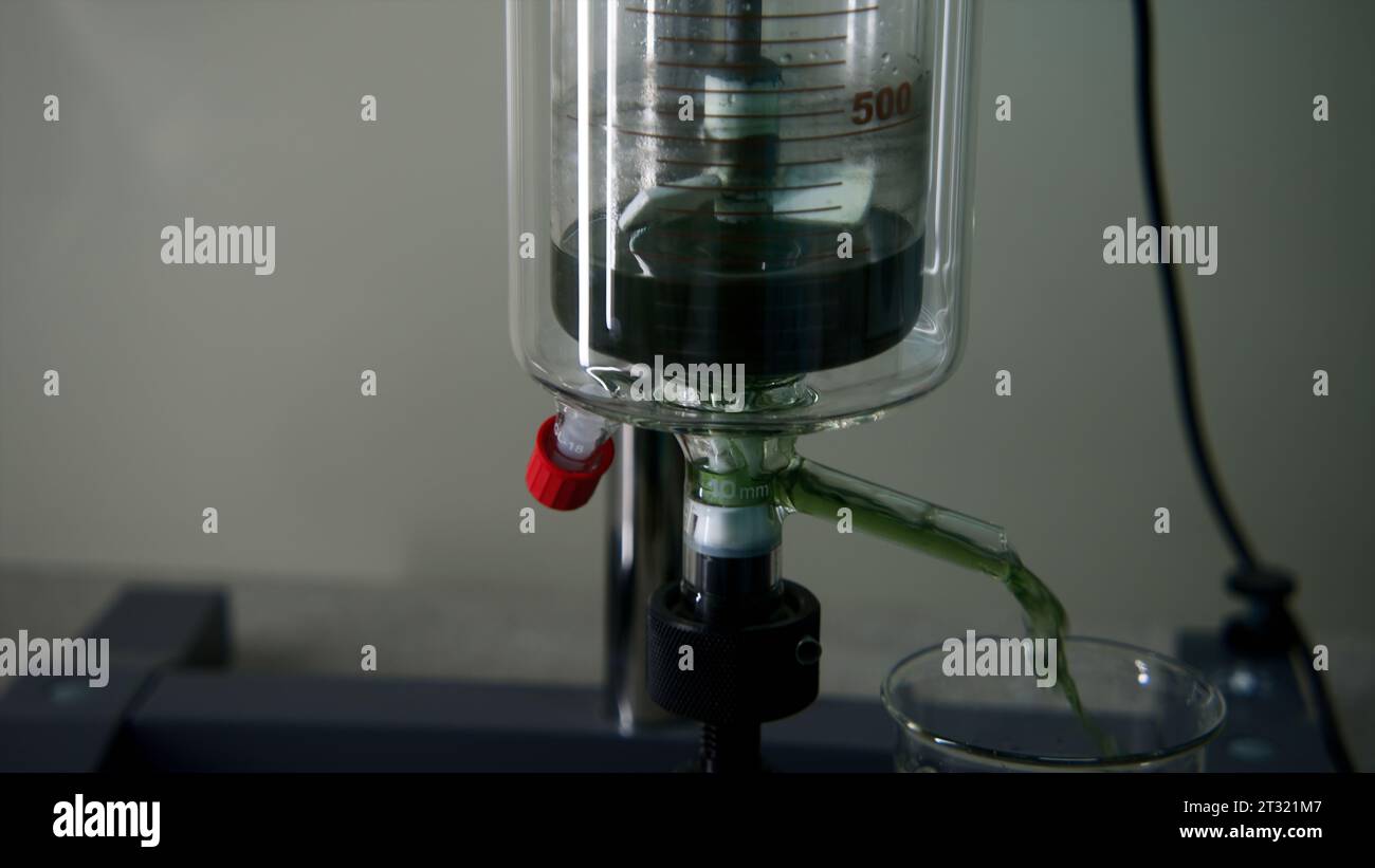 Chemical process. Stock footage. Working with green chemical elements ...