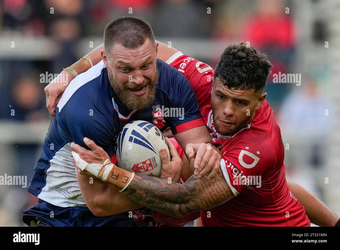 St Helens, UK. 22nd Oct, 2023. Starford To'a #2 of Tonga tackles ...