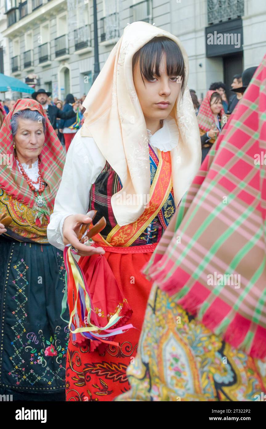 A woman in traditional country costume playing castanets during the ...