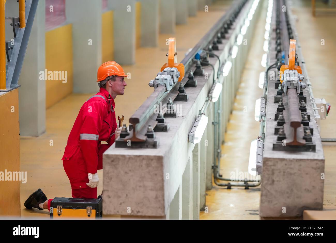 Engineer inspecting sky train in the maintenance plant Stock Photo - Alamy