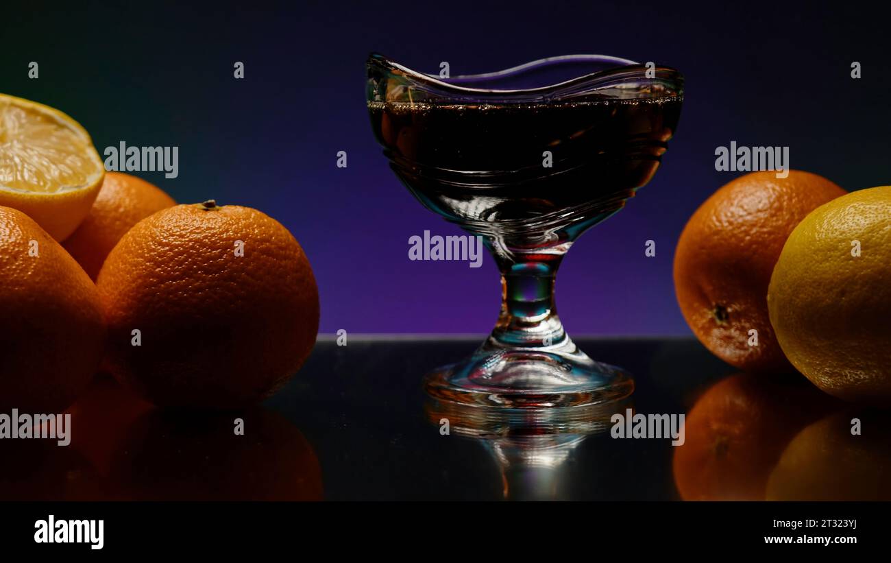 Still life with alcoholic cocktails. Stock clip. A colored background ...