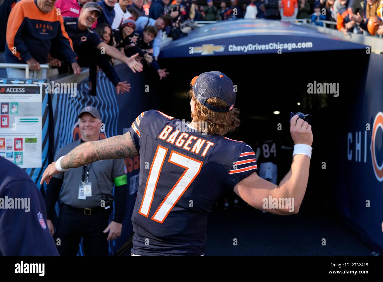 Chicago Bears quarterback Tyson Bagent throws a souvenir to fans as he ...