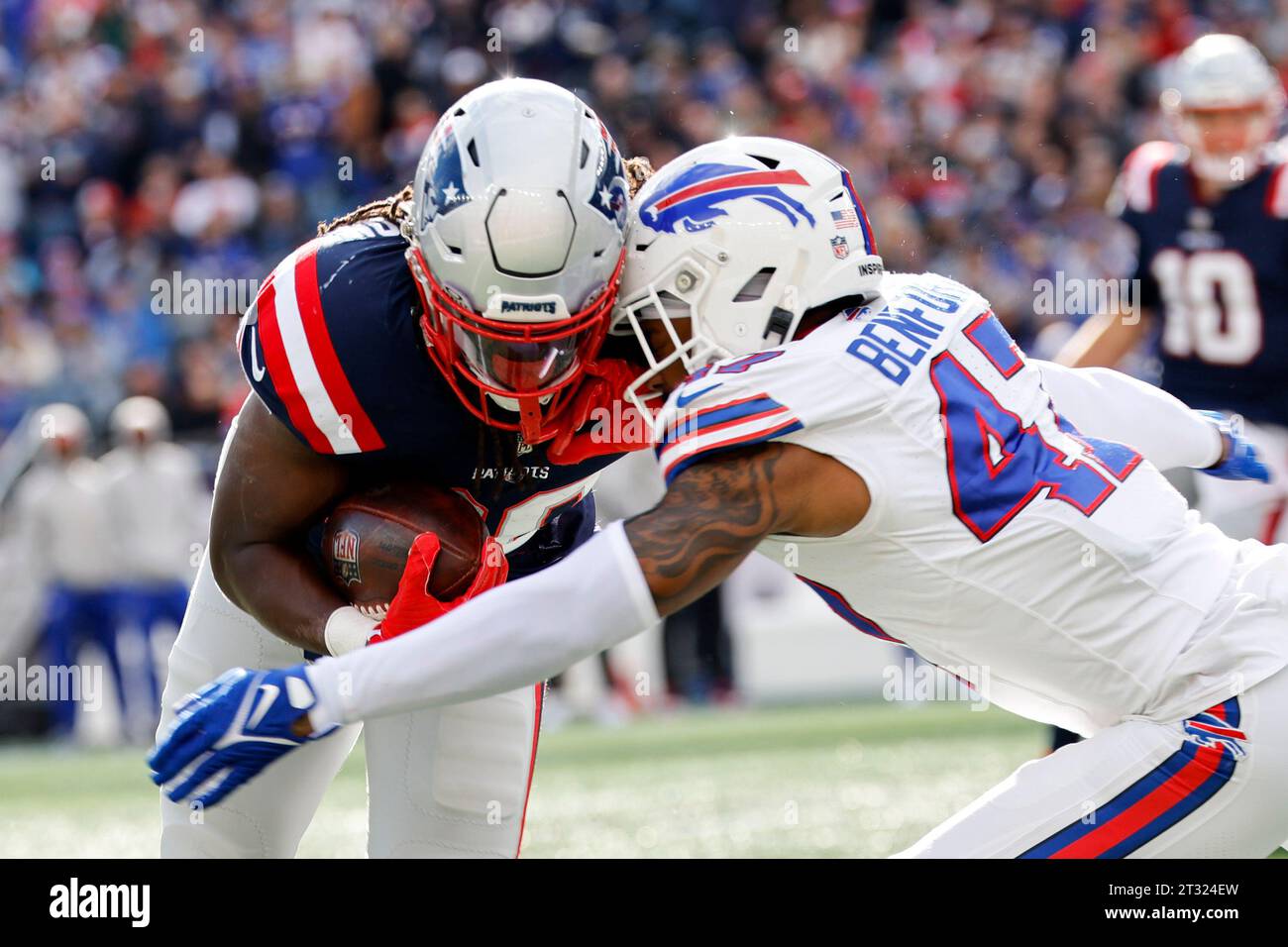 New England Patriots running back Rhamondre Stevenson (38) is tackled by Buffalo Bills ...