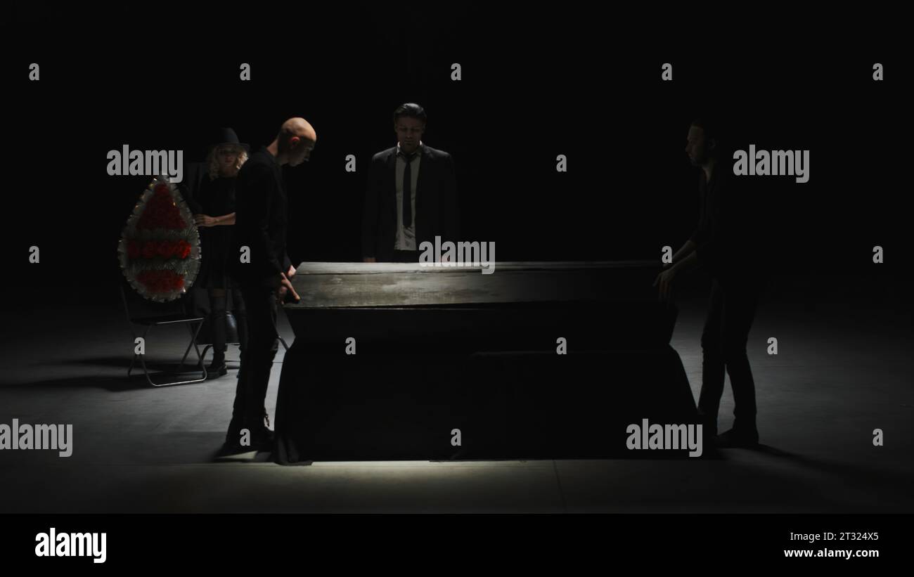 Theatrical production in dark room. Stock footage. Funeral on theater ...