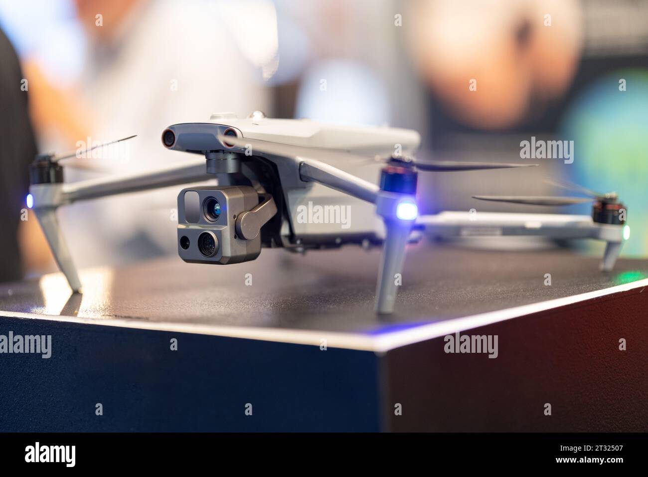 Drone with blue lights in flight Stock Photo - Alamy