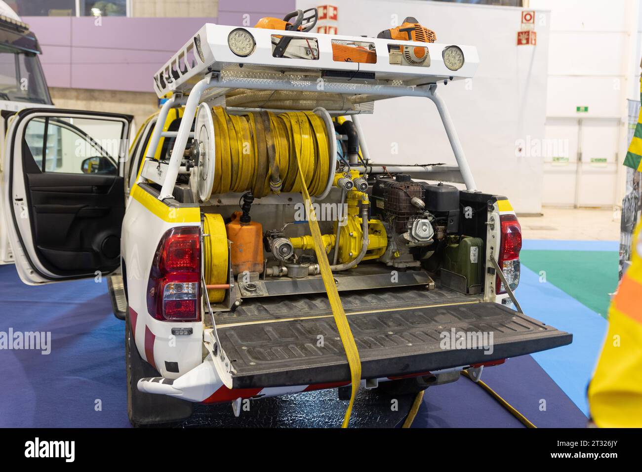 Yellow firefighting equipment with hanging parts Stock Photo - Alamy