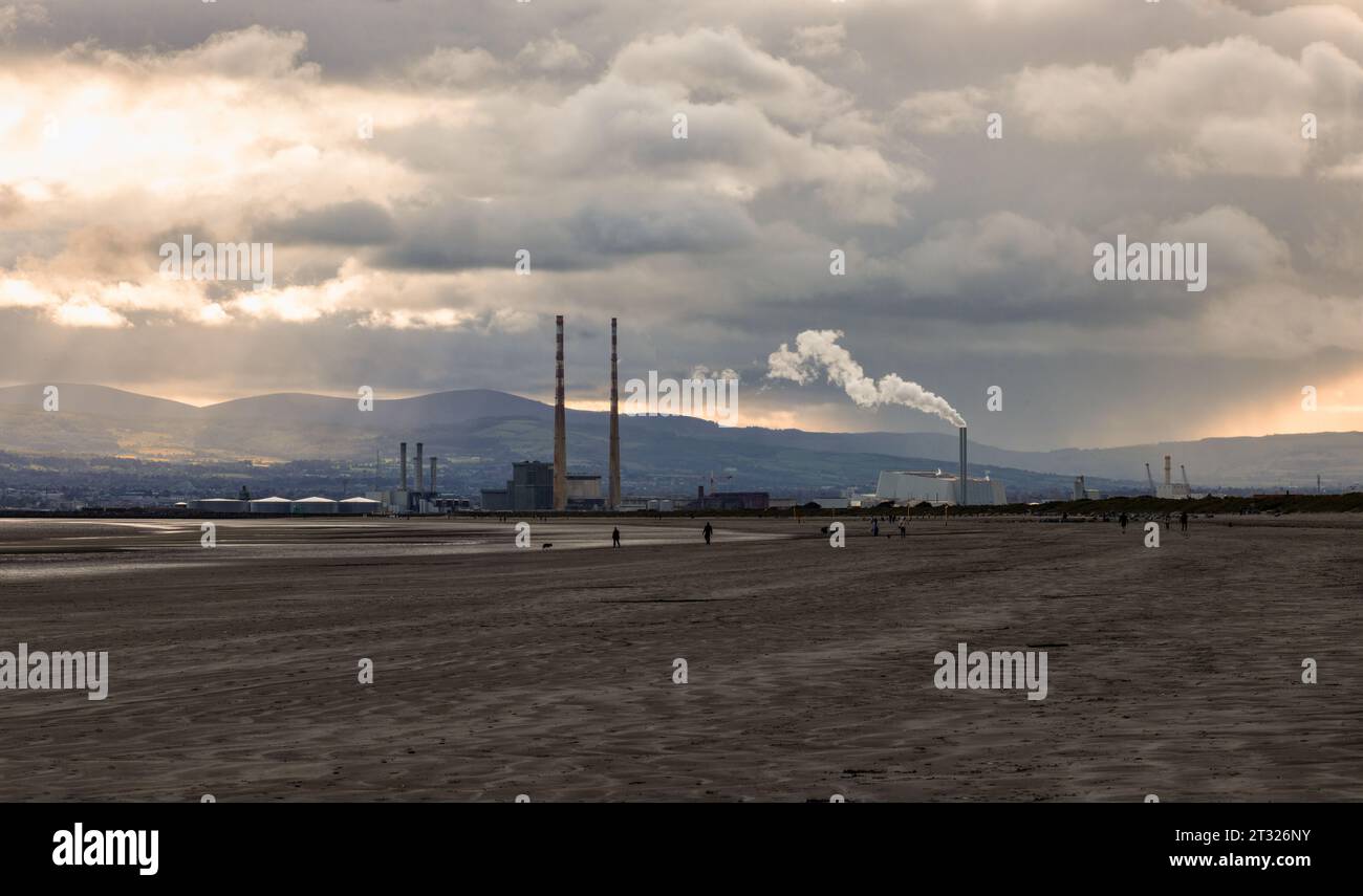 Light breaks through dark clouds on gloomy day at Dollymount Strand ...