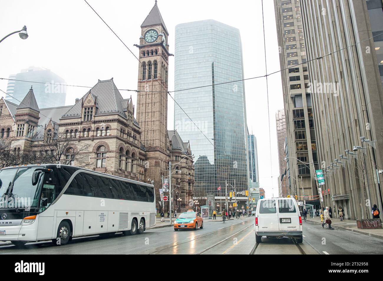 Old City Hall in Romanesque-style on a rainy day in downtown Toronto is ...