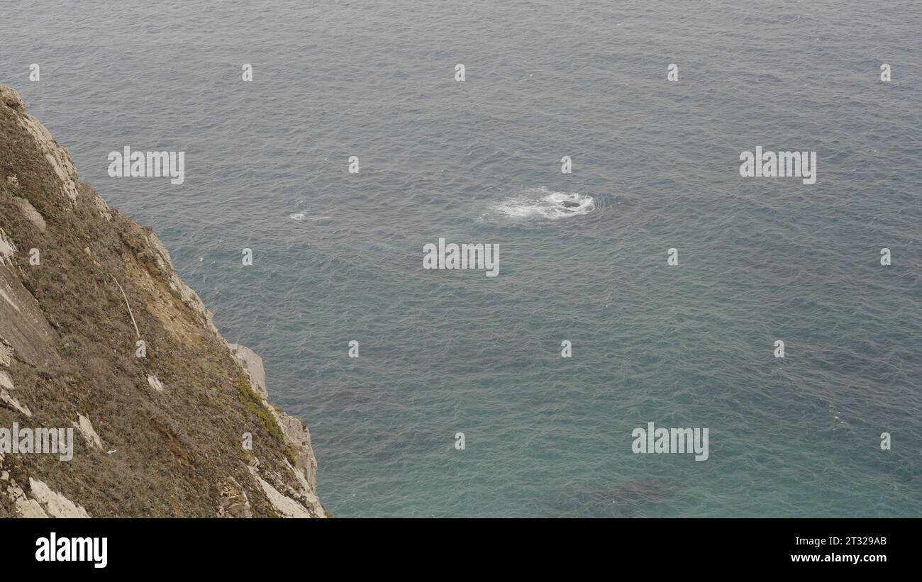 Rocky coastline alongside cliffside blue hi-res stock photography and ...