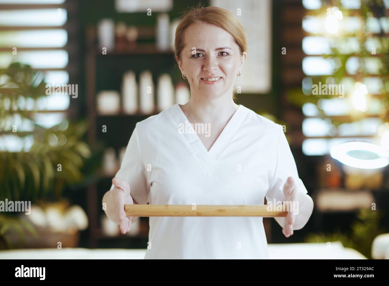 Healthcare Time Smiling Female Medical Massage Therapist In Massage