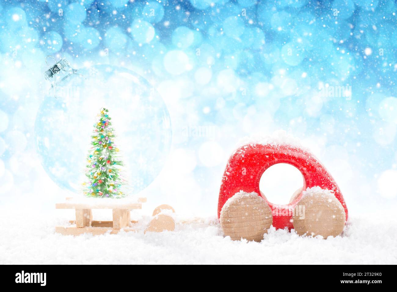 Red Wooden Car Pulling Sled with A Transparent Christmas Ball with ...