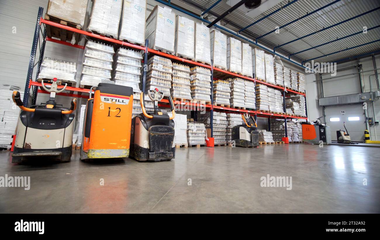 Vehicles working in a warehouse. Creative. Industrial production ...