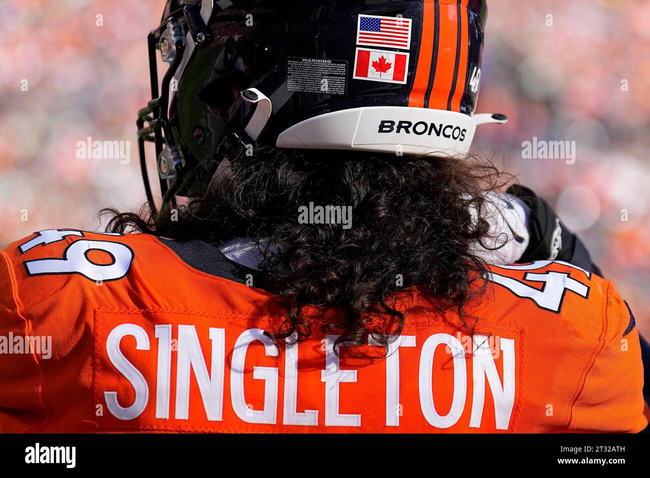 An international flag decal is shown on the helmet of Denver Broncos ...