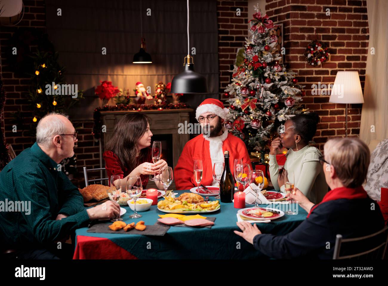 Person santa claus cosplay at dinner making people laugh and celebrating christmas eve festivity ...