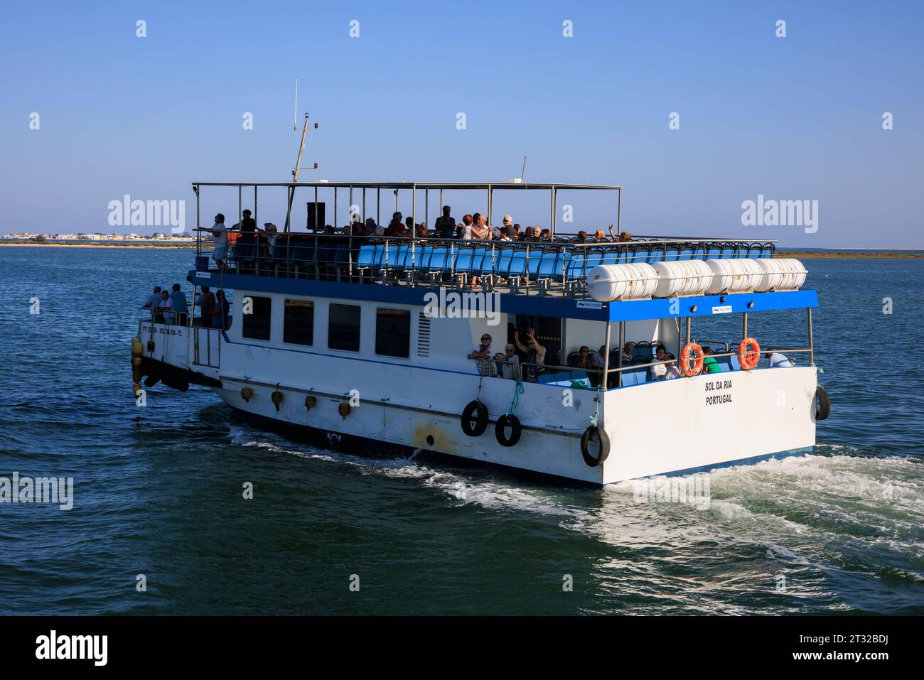 A public ferry boat leaving Olhão in Portugal Stock Photo - Alamy