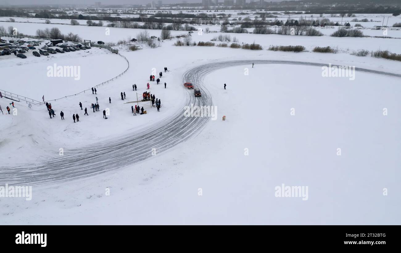 Winter track during race, view from drone. Clip. Aerial view of cars ...