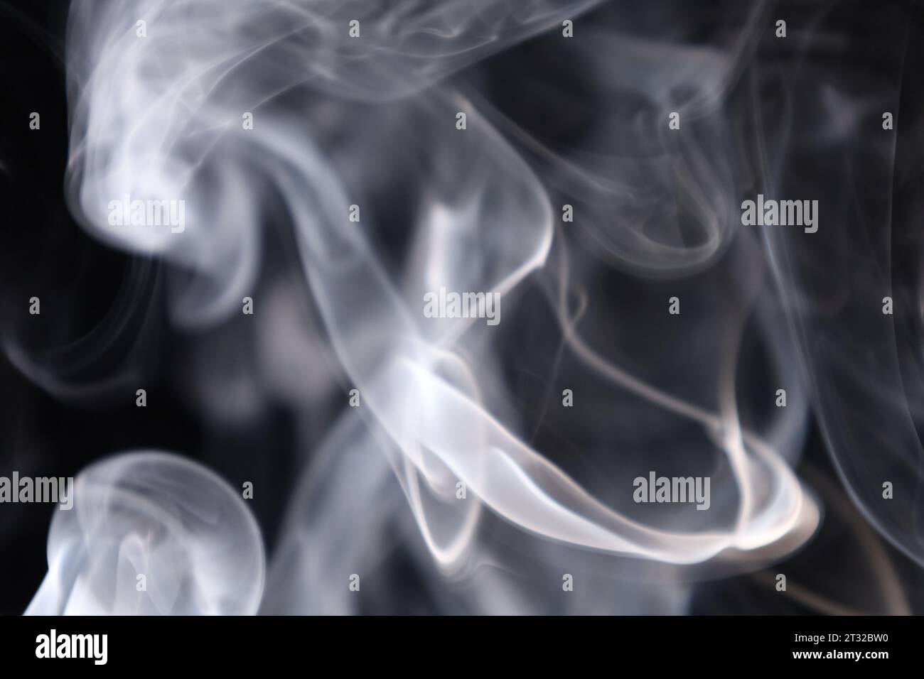 White silver smoke on a dark background, colourful abstract, white fog ...