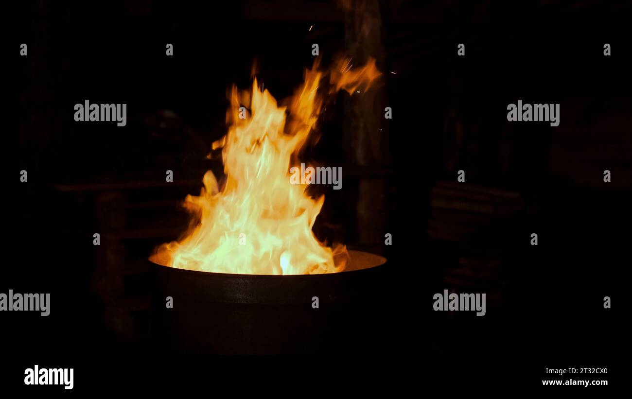 Burning flame at the metal barrel. Clip. Close up of burning fire flame ...