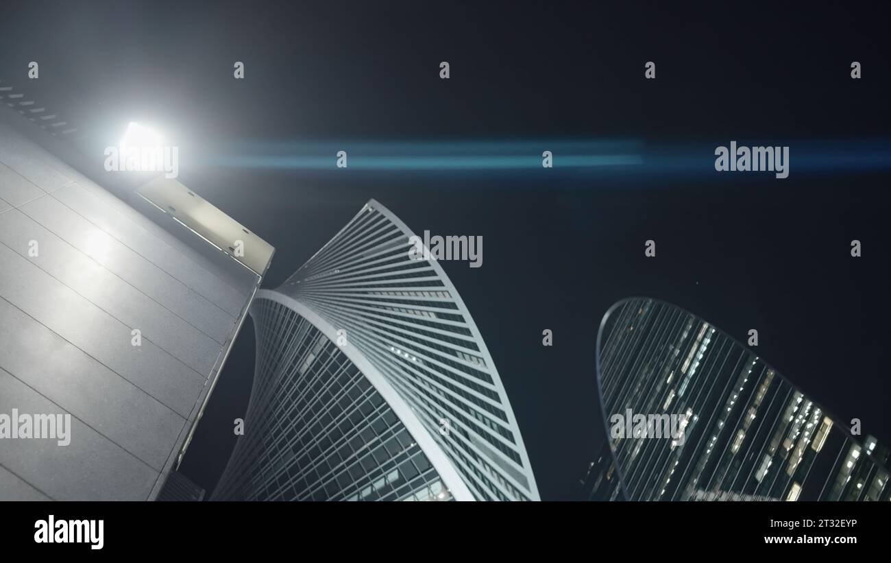 Bottom view of lantern and modern skyscrapers. Action. Bright street ...