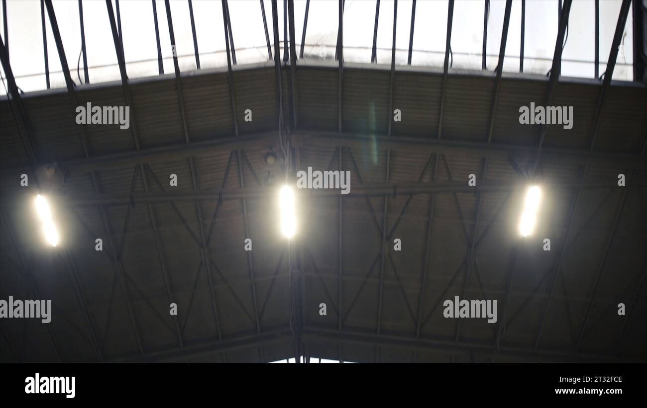 Bottom view of warehouse ceiling. Clip. Ceiling of industrial room with ...
