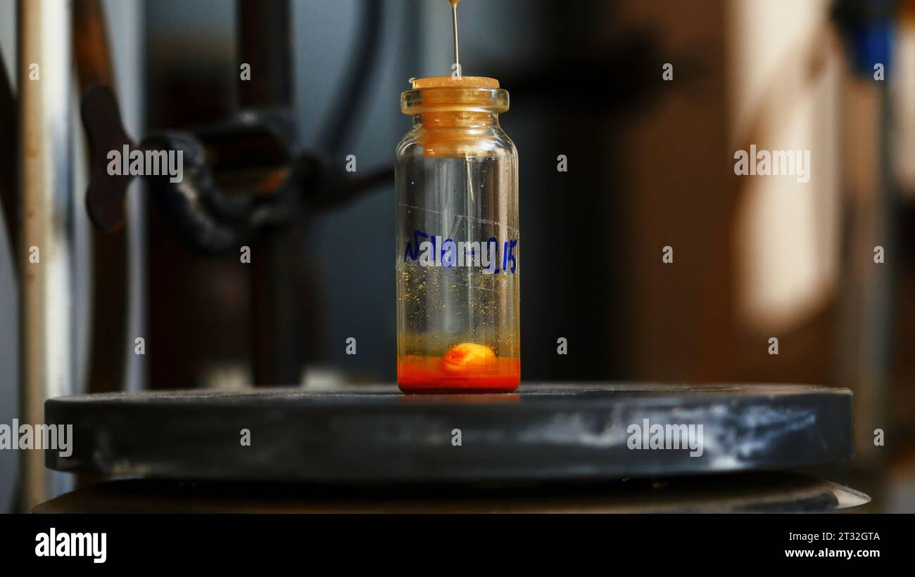 Laboratory test tube with rotating particle and liquid. Stock footage ...