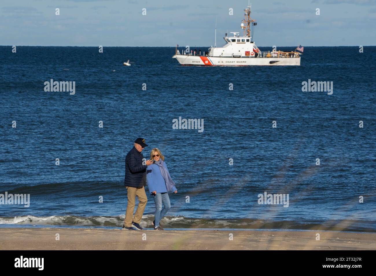 President Joe Biden and first lady Jill Biden walk along the beach in ...