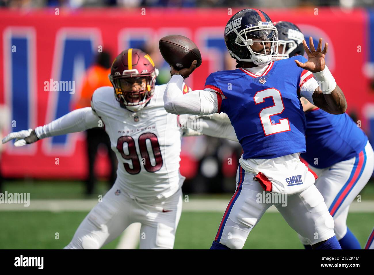 New York Giants quarterback Tyrod Taylor (2) passes under pressure from ...
