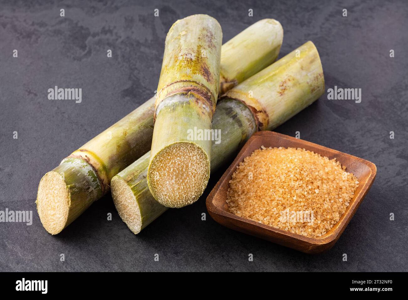 Brown sugar with natural cane stems - Saccharum officinarum Stock Photo ...