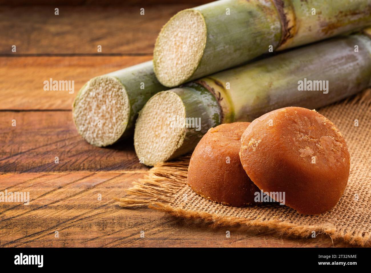 Saccharum officinarum - Sweet panela with sugar cane stalks Stock Photo ...