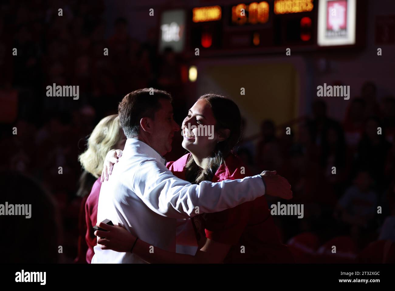 Indiana women’s basketball player Mackenzie Holmes is gets a hug from ...