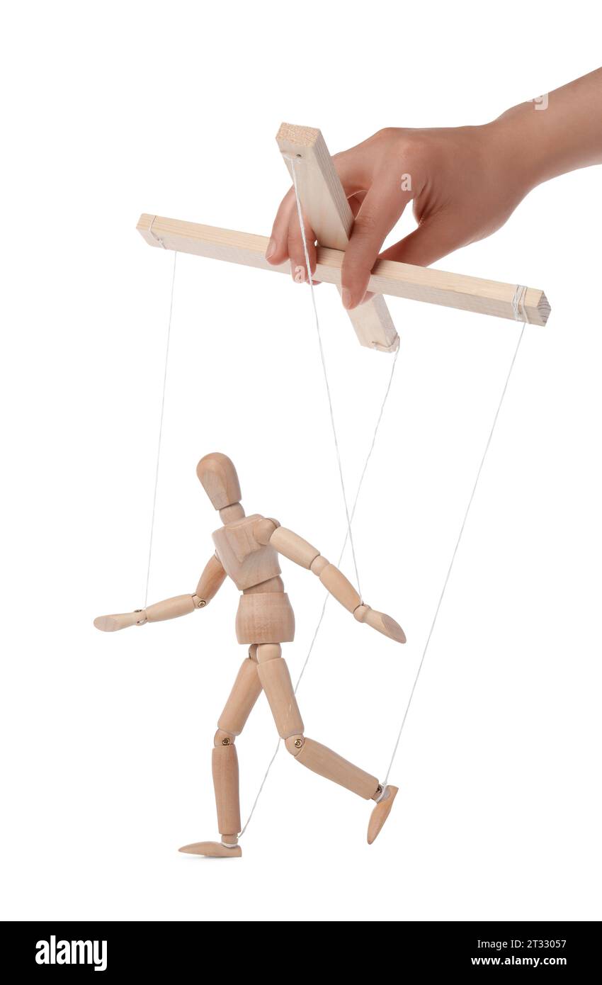 Woman pulling strings of puppet on white background, closeup Stock ...