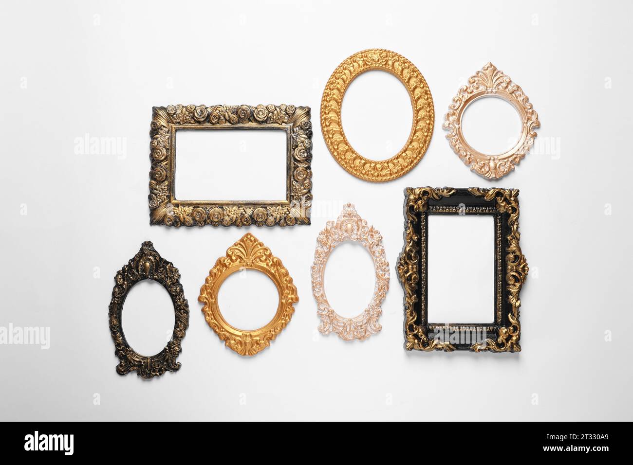 Empty vintage frames hanging on white wall Stock Photo - Alamy