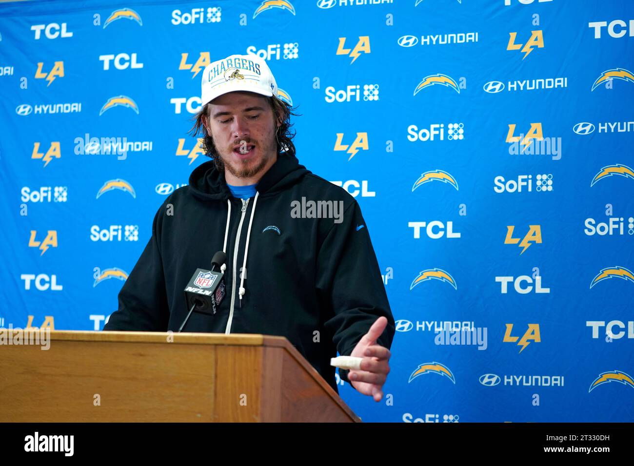 Los Angeles Chargers quarterback Justin Herbert looks at his injured ...