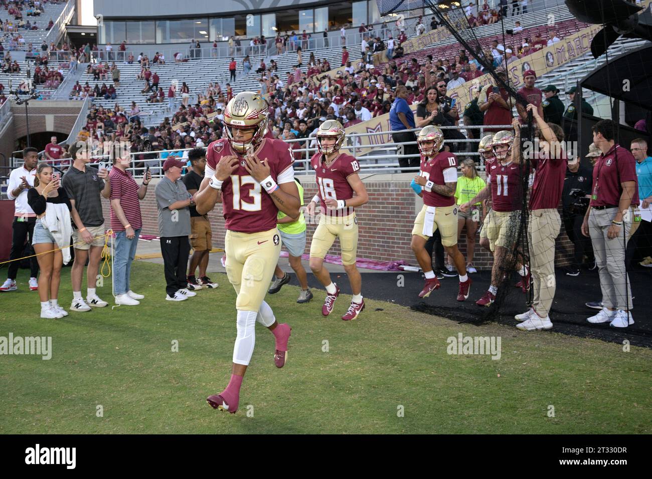 Florida State quarterback Jordan Travis (13) leads the team's ...