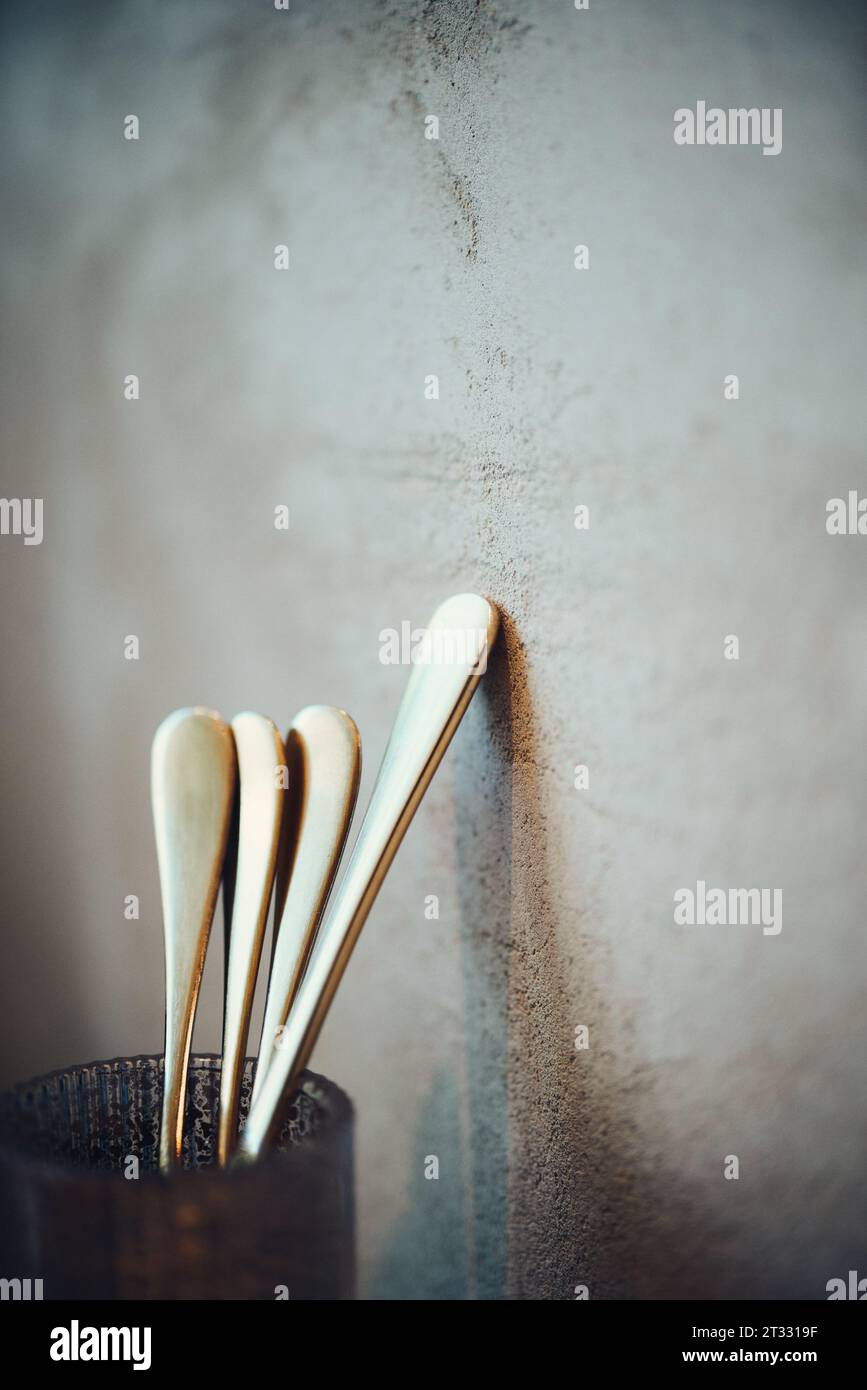Metal Spoon and Concrete Wall Stock Photo - Alamy