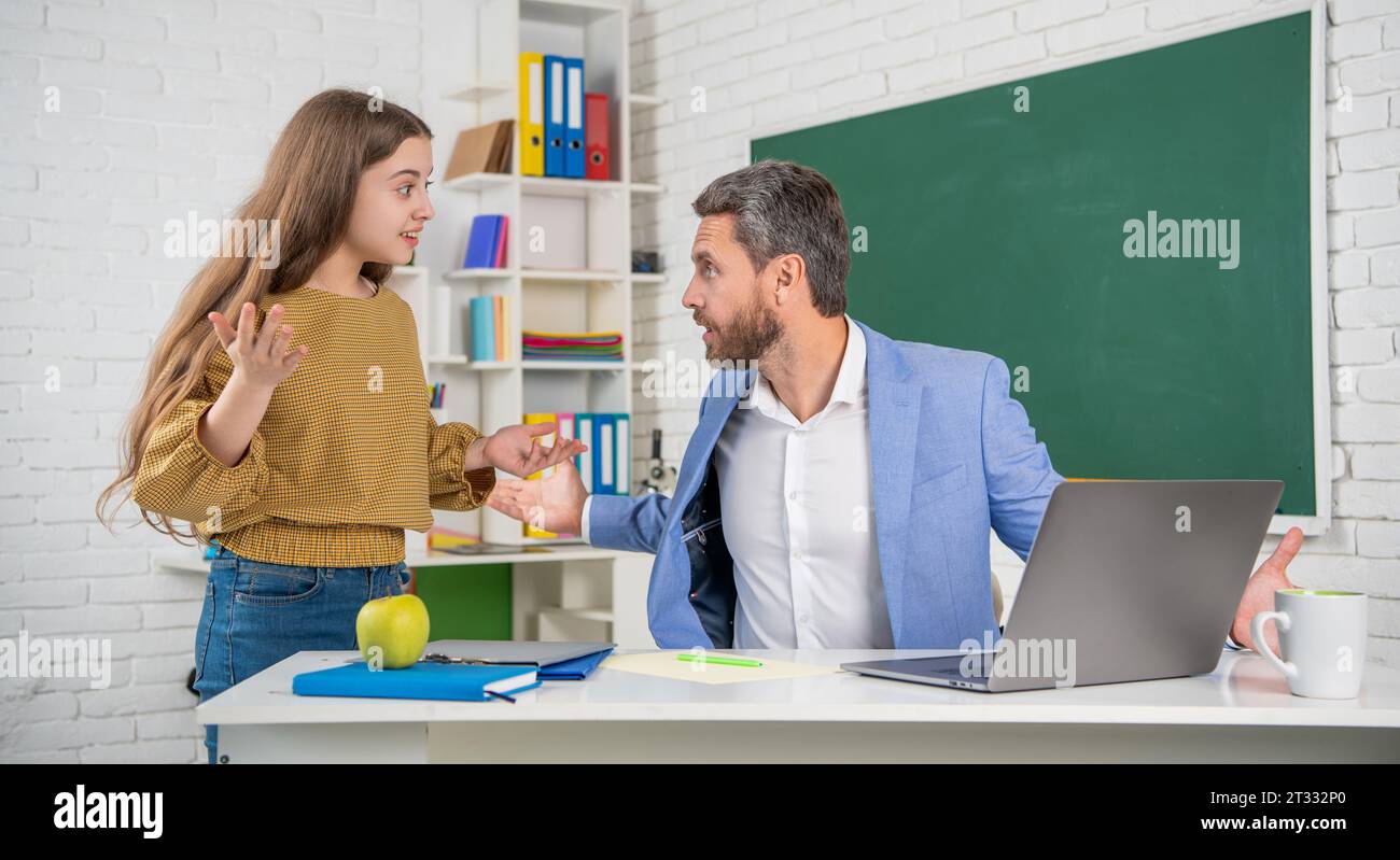 surprised child with man tutor in classroom. education Stock Photo - Alamy