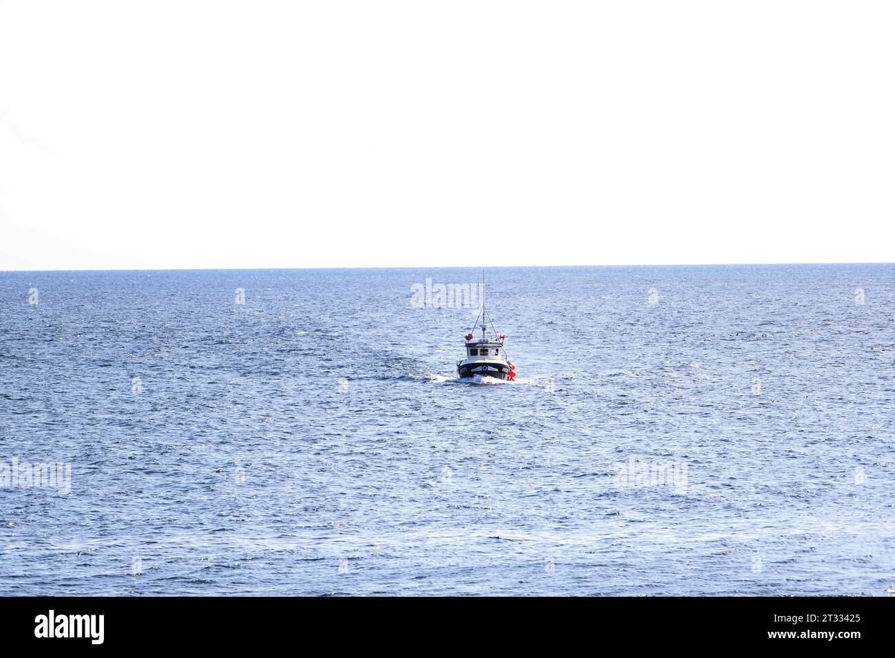 An ocean-going vessel is seen cruising through the open seas in Lybster ...