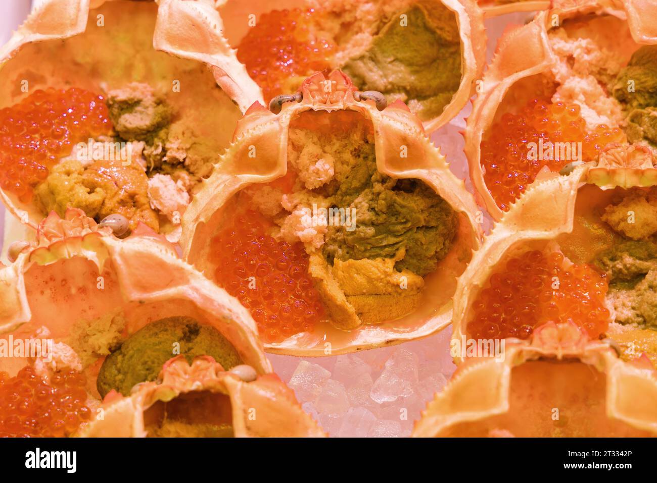 Caviar and seafood pastes garnished in a crab shell, at a street market ...