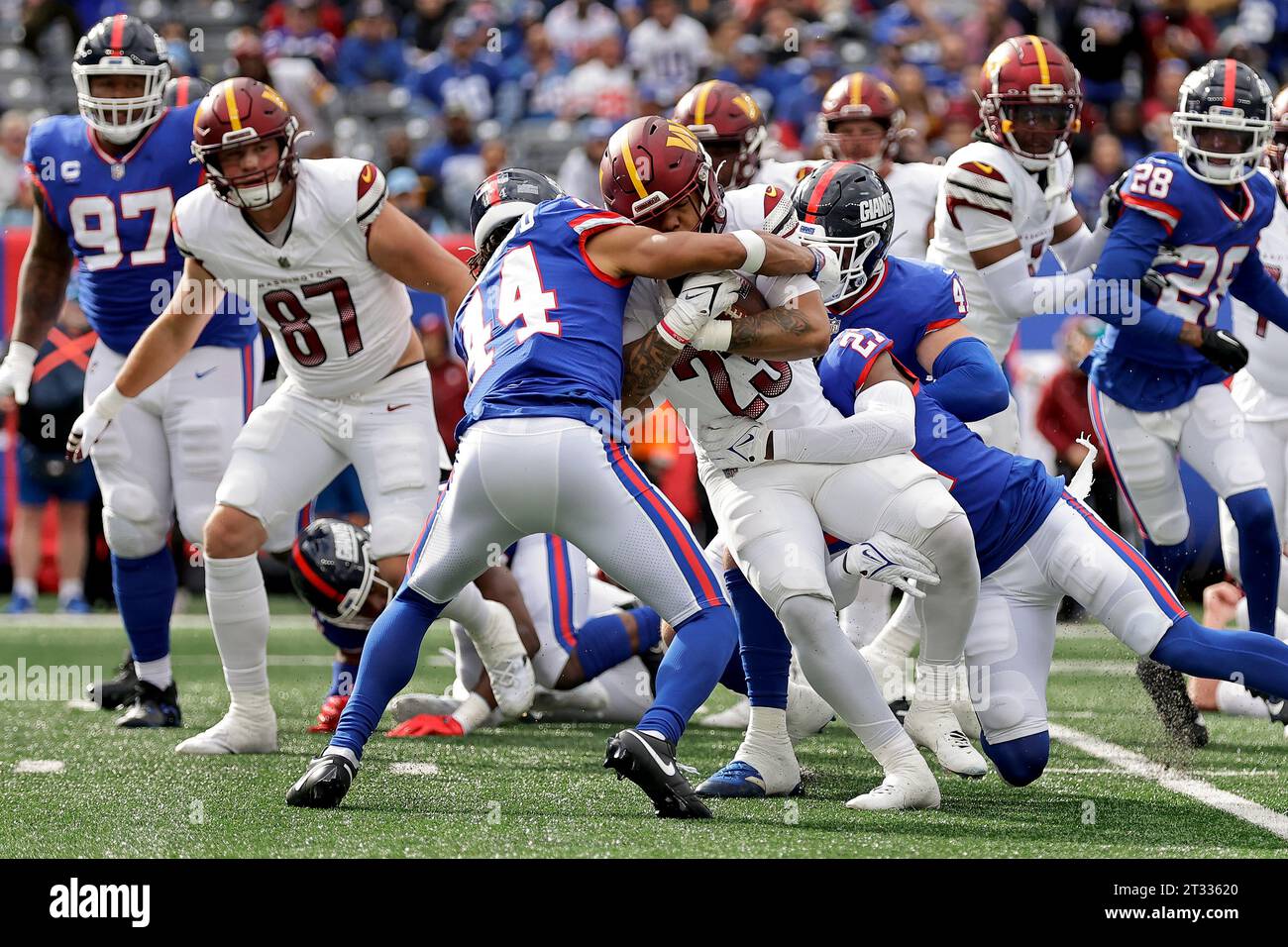 Washington Commanders running back Chris Rodriguez Jr. (23) is tackled ...