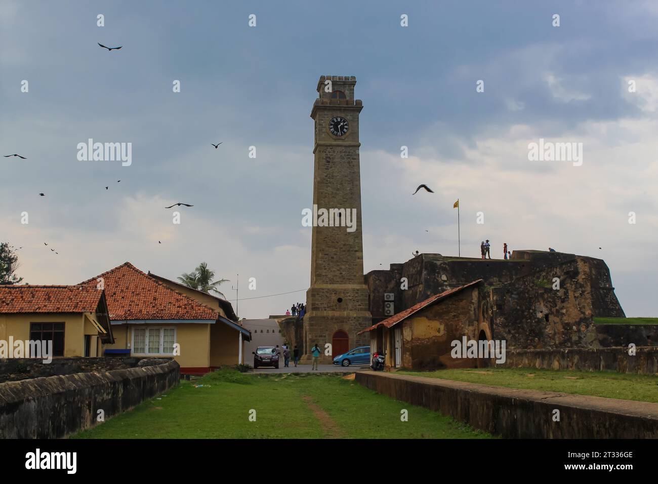 Birds flying over the old clock tower at Galle Dutch Fort 17th Century ...